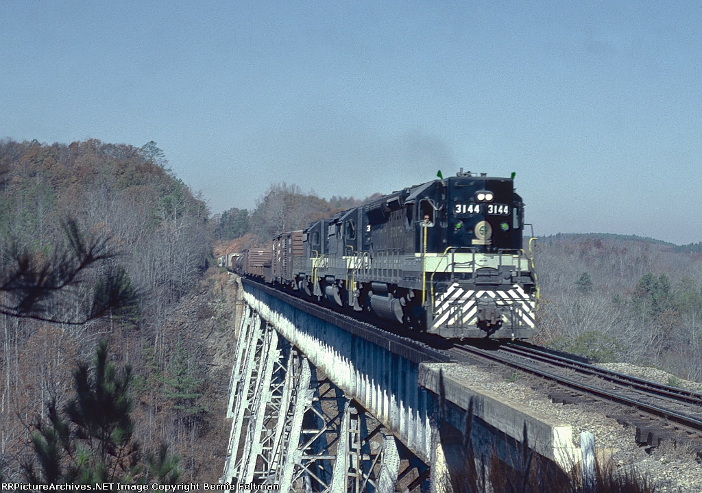 Southern Railway SD45 #3144, flying green "section" flags, leads Southern Railway train 2nd #136 ...